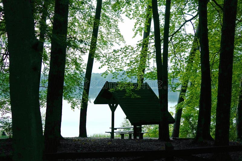 Wooden Gazebo for Relaxing in the Forest on the Lake Shore Stock Image ...
