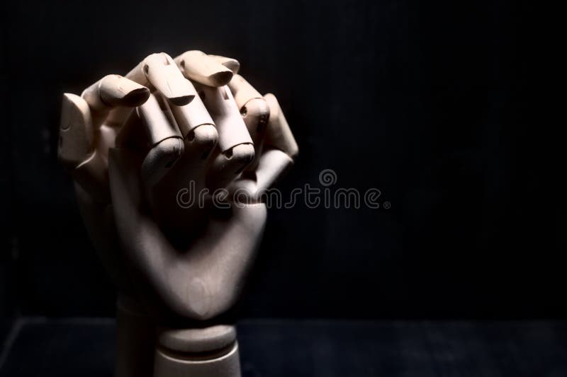 A Wooden Hand that Grasps a Wooden Hand Tightly Closed Stock Photo ...