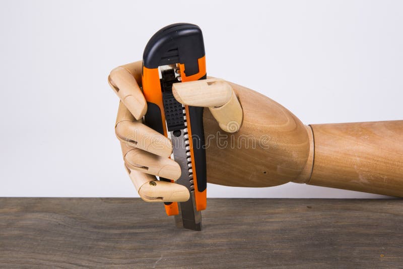 Wooden Hand with Office Cutting Knife Stock Image - Image of steel ...