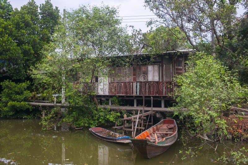Wooden House , Boat and Tree Near the River Stock Image - Image of ...