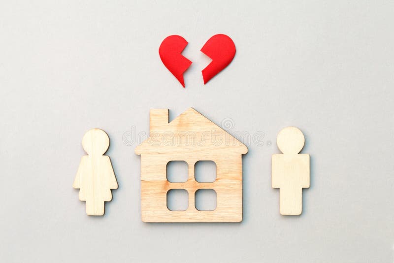 Wooden House And Models Of Man And Woman With Red Broken Heart Divorce