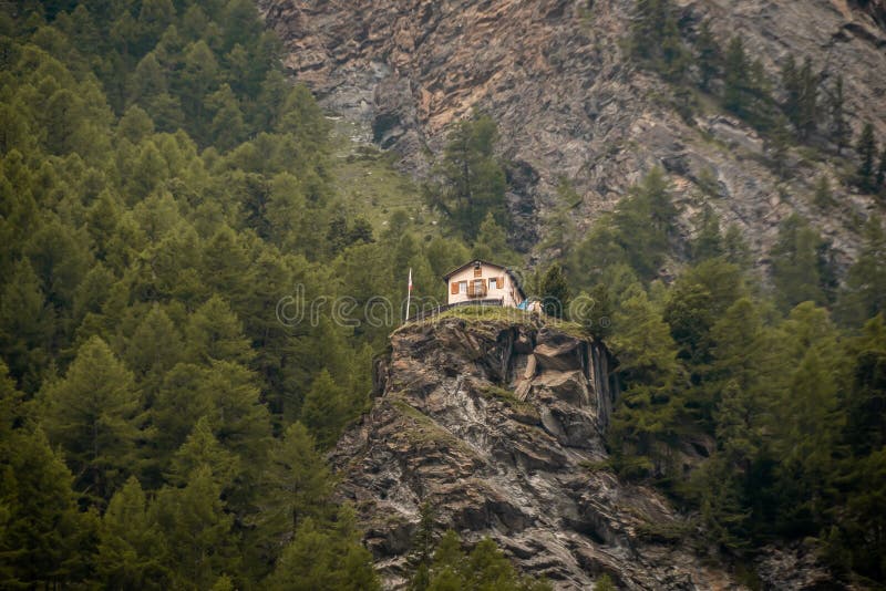 Wooden House in the Mountains Alps. House at the Top of the Cliff ...