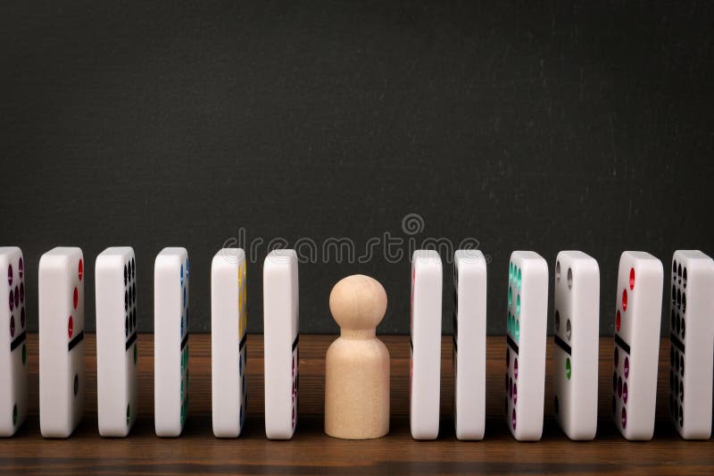 Wooden Human Figure among Dominoes. Competition Concept Stock Image ...