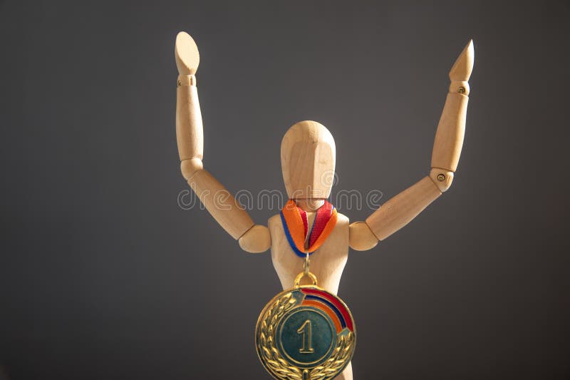 Wooden Human Figure with a Winner Medal Stock Photo - Image of ...