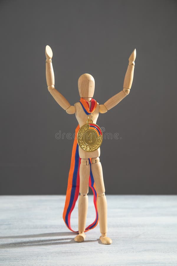 Wooden Human Figure with a Winner Medal Stock Photo - Image of wooden ...