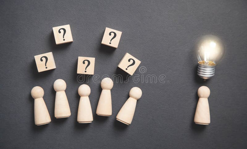 Wooden Human Figures, Cube with a Question Mark Symbol and Light Bulb ...