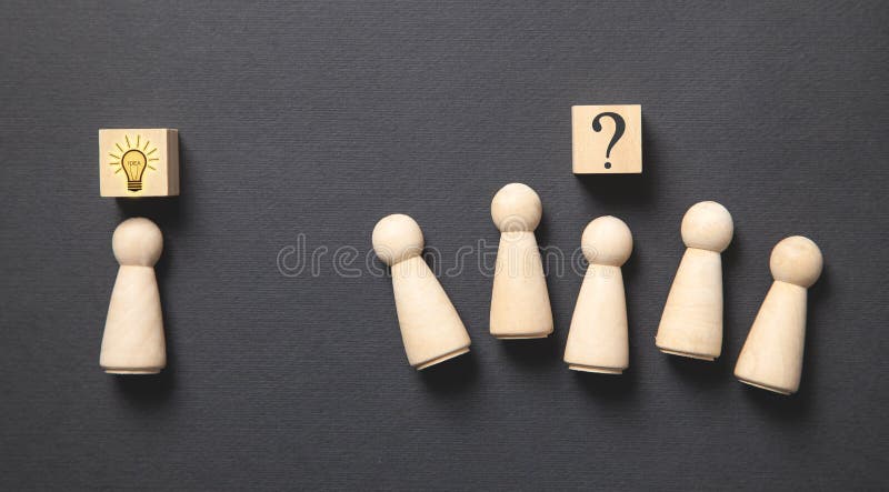 Wooden Human Figures. Light Bulb and Question Mark on Wooden Cubes ...