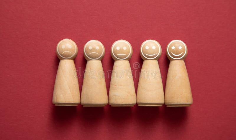 Wooden Human Figures with Positive and Sad Face. Customer Evaluation ...