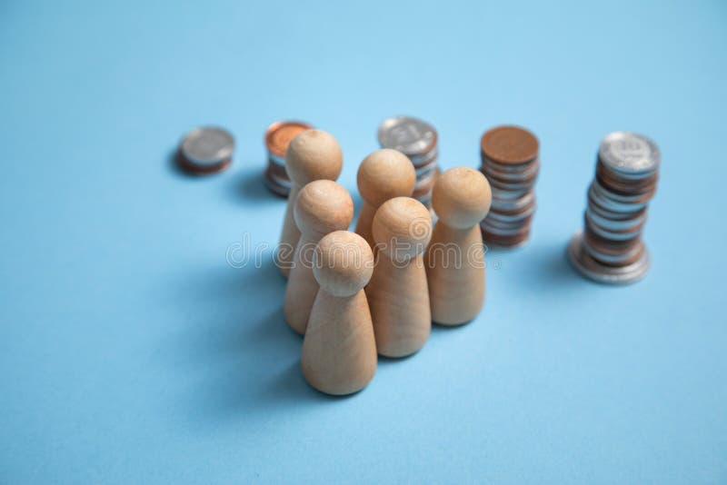 Wooden Human Figures with a Stack of Coins Stock Photo - Image of stack ...