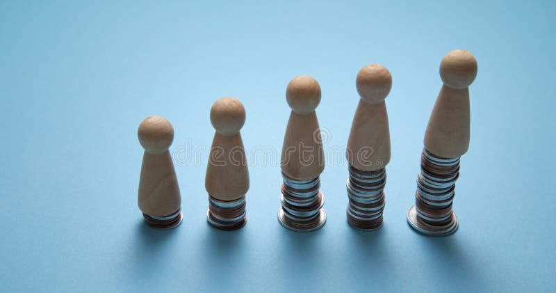 Wooden Human Figures with a Stack of Coins Stock Image - Image of ...