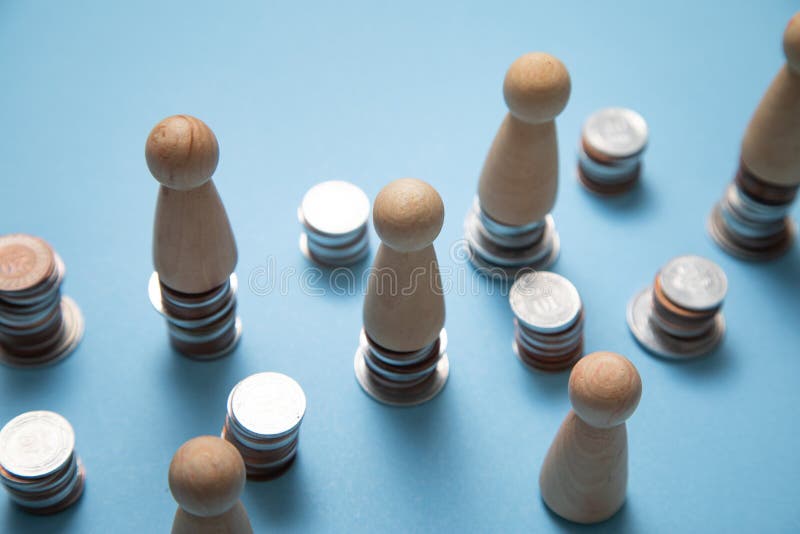 Wooden Human Figures with a Stack of Coins Stock Image - Image of money ...