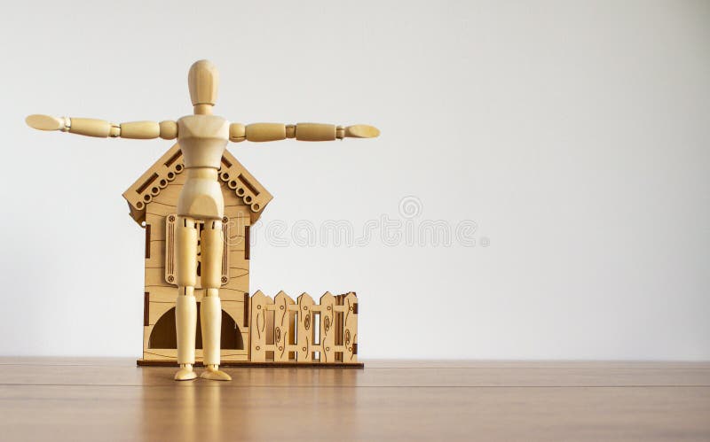 Wooden Human Model in Front of a House Model. Concept Stock Image ...