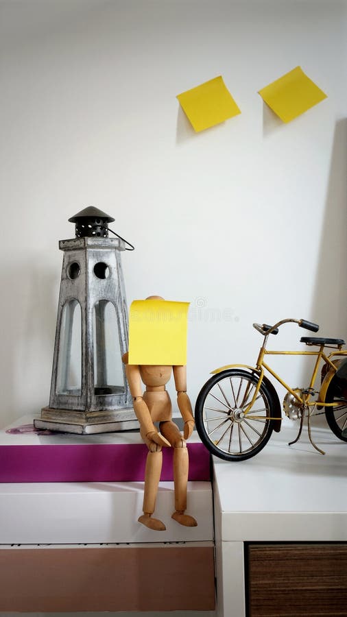 Wooden Human Talking or Presentation with Blank Yellow Paper on Wall ...