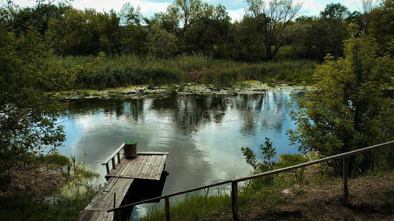 Wooden Jetty on River in a Green Landscape Stock Image - Image of grass ...