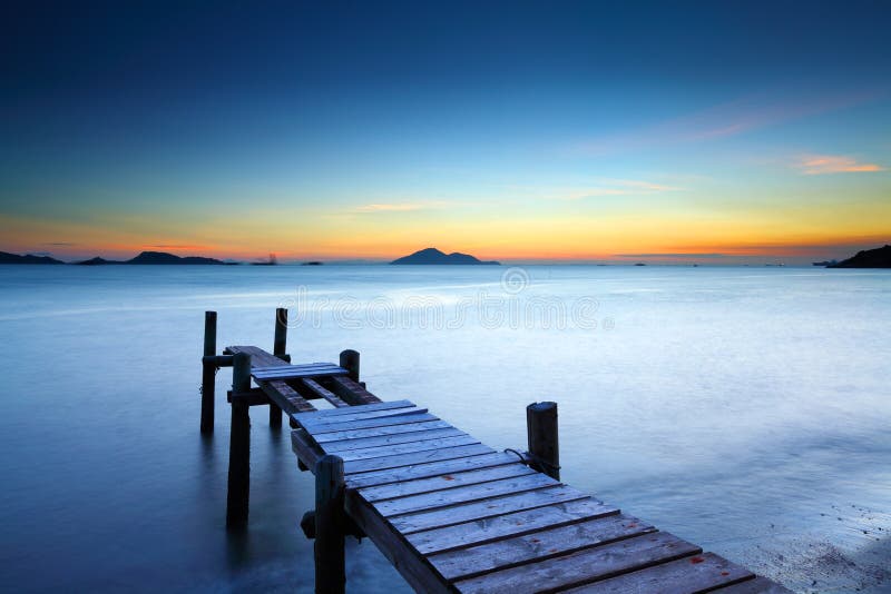 Wooden jetty with sunset stock photo. Image of sunrise - 38455040