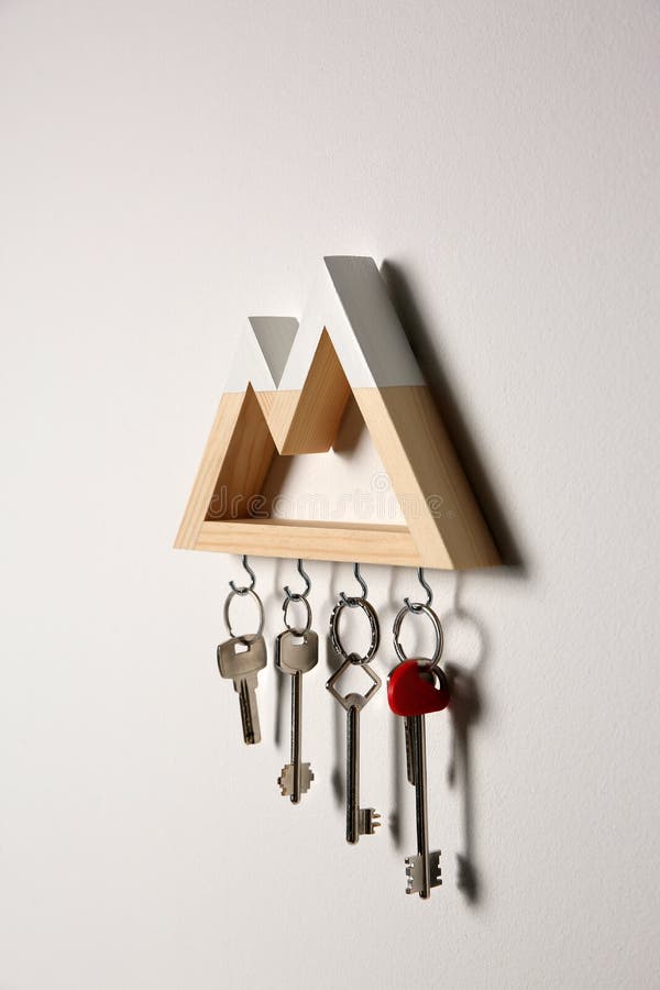 Wooden Key Holder on Grey Wall Stock Photo - Image of hanging, lock ...