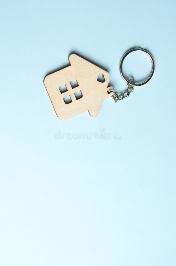 Keychain in the Shape of a House with a Key in the Hands of a Person ...