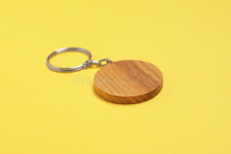 Wooden Keychain in Shape of Smiley Face on Yellow Background Stock ...