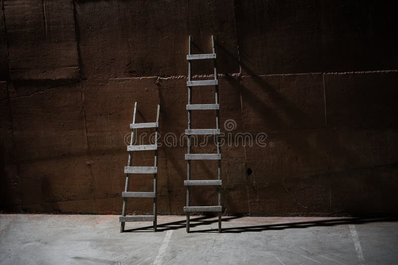 Two ladders on brown wall stock image. Image of line - 247480481
