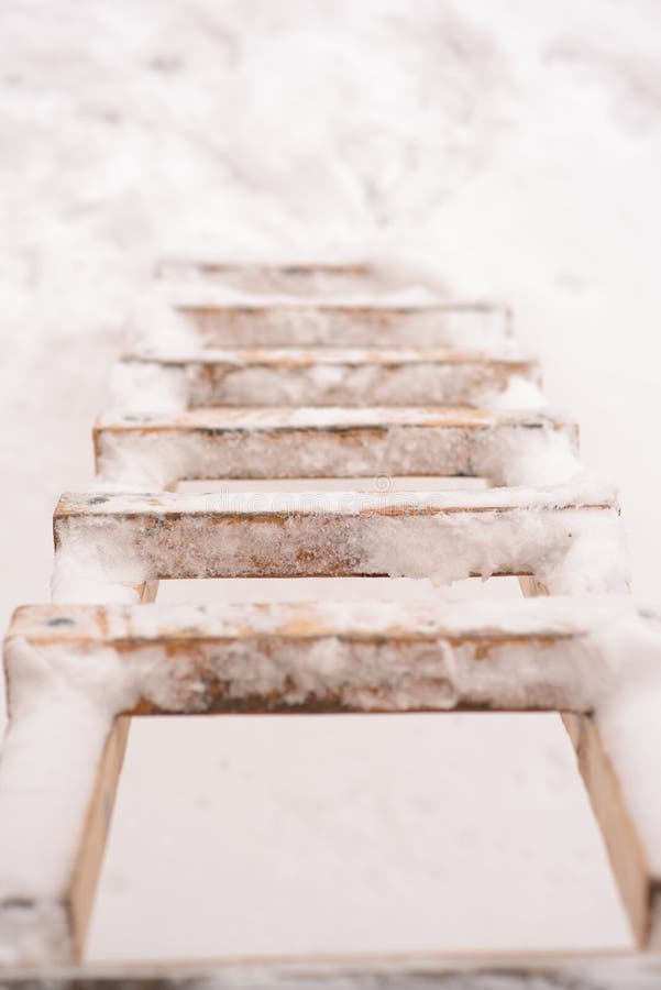 Wooden ladder in the snow stock image. Image of equipment - 83952919