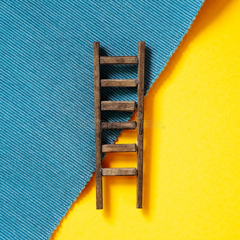 Wooden Ladder on Yellow and Blue Background Stock Photo - Image of ...