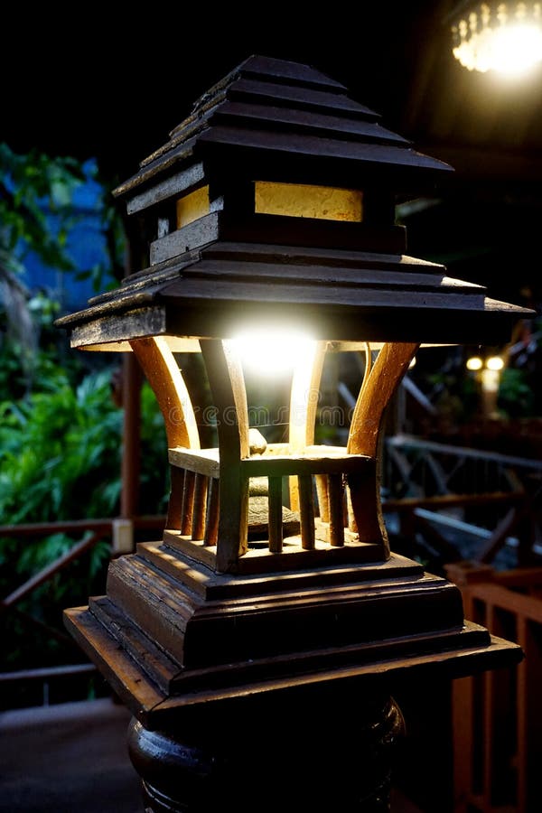Wooden Lantern with Light Bulb at Baluster Stock Image - Image of ...