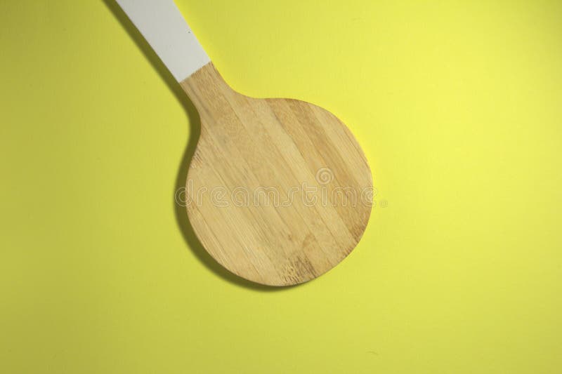 Wooden Large Spoon. on a Yellow Background. Stock Image - Image of ...