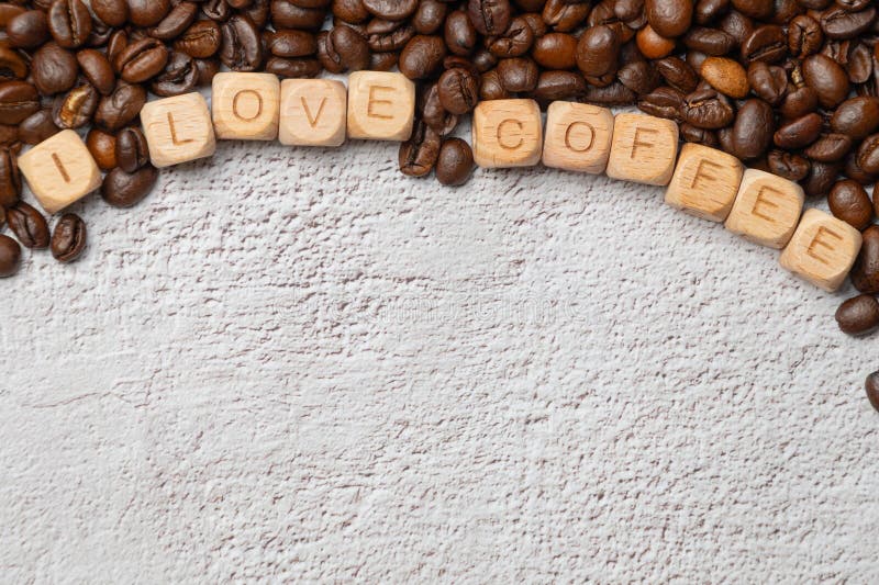 Wooden Letter Blocks and Coffee Beans on Textured Surface Stock Photo ...