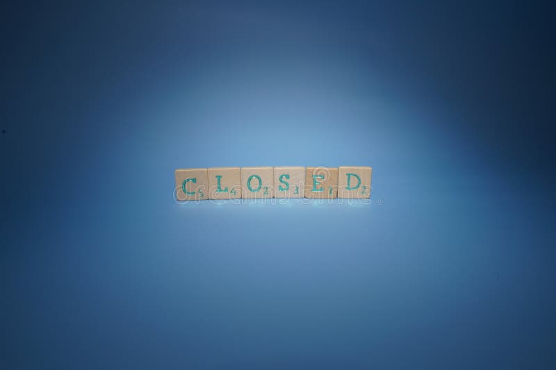 Wooden Letters Spell "closed" Against a Blue Backdrop Stock Image ...