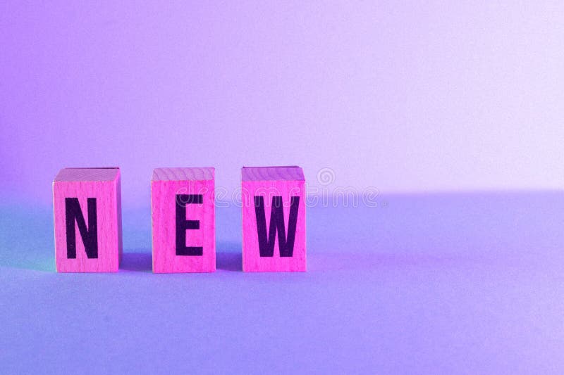 Wooden Letters with the Word NEW on Blue Background Stock Photo - Image ...