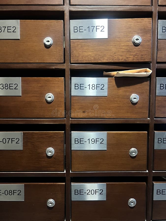 Modern Wooden Brown Mailboxes with Numbers in the Lobby of a ...