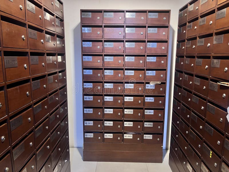 Modern Wooden Brown Mailboxes with Numbers in the Lobby of a ...