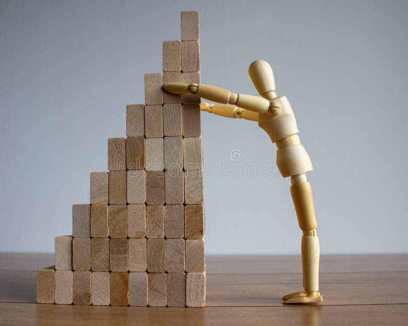 Wooden Model of Human Put Wooden Blocks on the Stack of Wooden Blocks ...