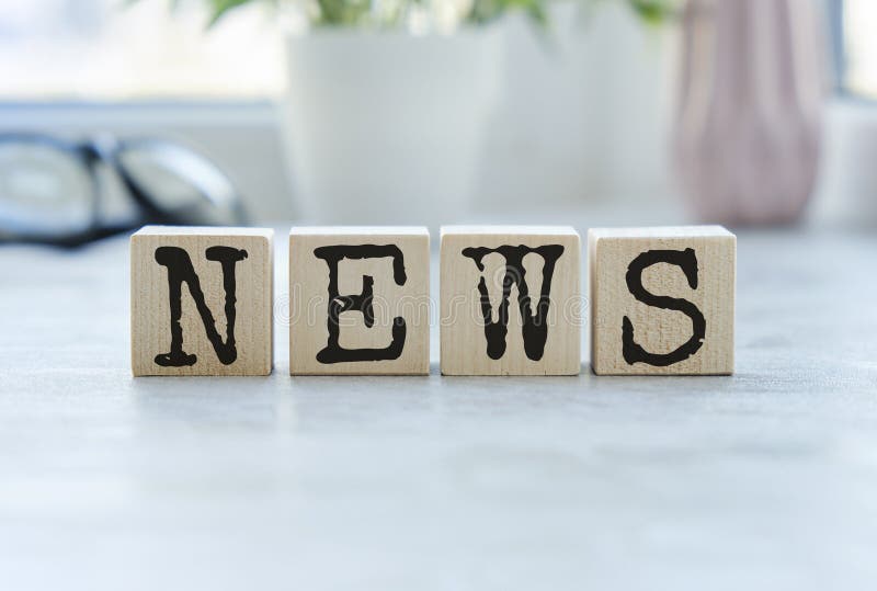 Wooden News Sign on a Table in an Office Stock Image - Image of media ...