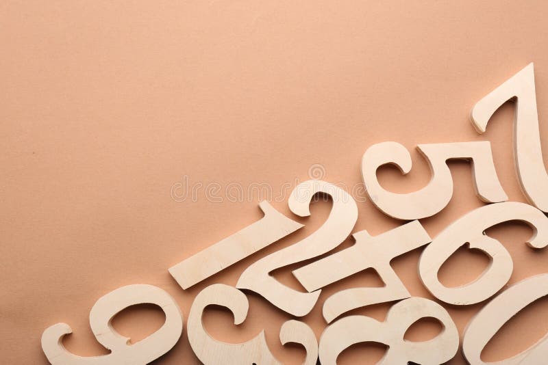 Wooden Numbers on Beige Background, Flat Lay. Space for Text Stock ...