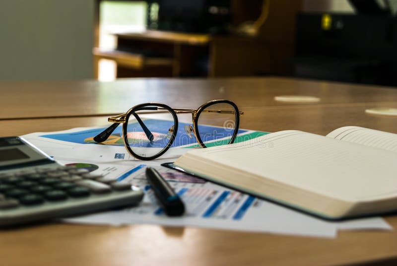 Wooden Office Desk with Open Diary Book and Data Chart Stock Image ...