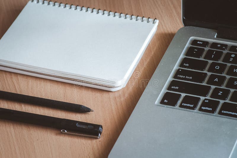Wooden Office Desk Table with Notebook Open, Pens and Computer. Stock ...