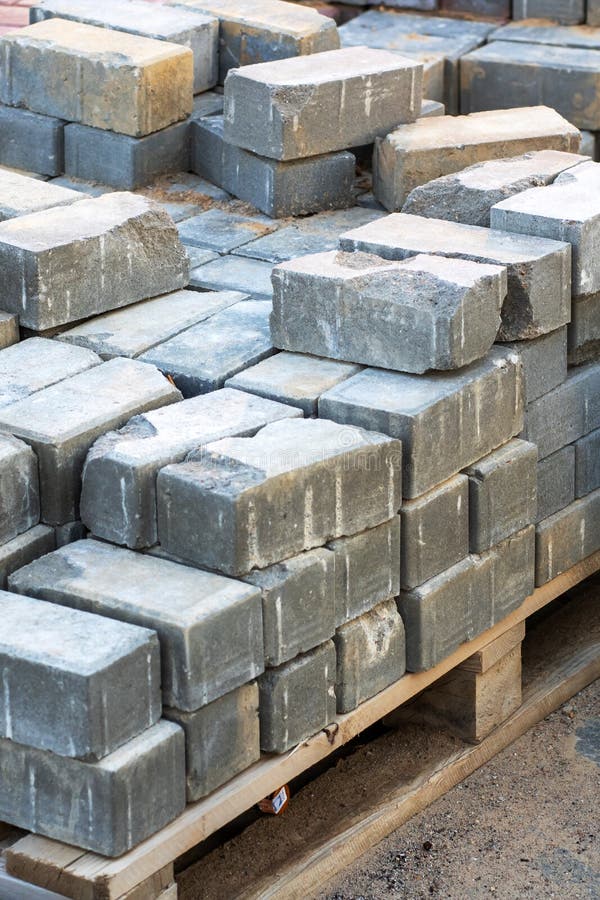 A Wooden Pallet that is Filled with Multiple Bricks on a Construction ...