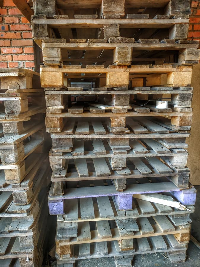Old pile of wooden pallets stock photo. Image of pile - 145926170