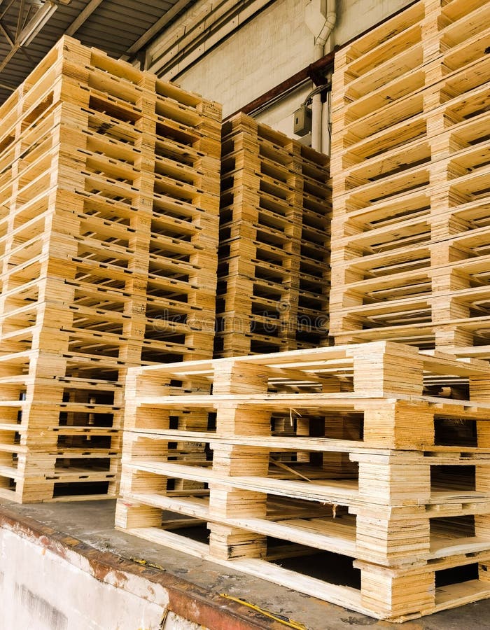 Wooden Pallets Stack at the Freight Cargo Warehouse for Transportation ...