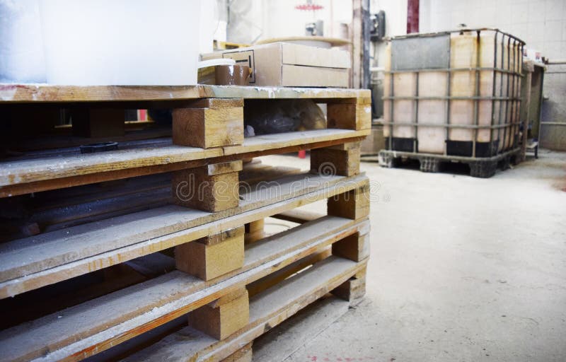 Wooden Pallets Stacked in a Production Area. Workshop for the ...