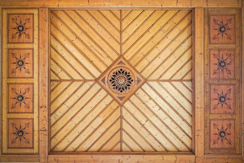 A Wooden Panel with a Diamond Shape in the Middle and a Floral Design ...