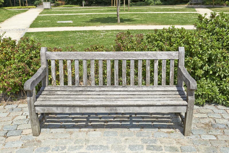 Wooden Park Bench in the Garden Stock Image - Image of season, tranquil ...