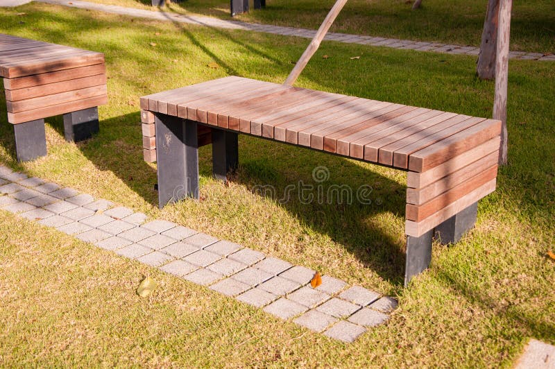 Wooden Park Bench in Garden Stock Image - Image of design, seating ...
