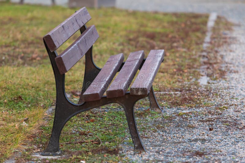 A Wooden Park Bench on a Gravel Path Stock Photo - Image of wood, side ...