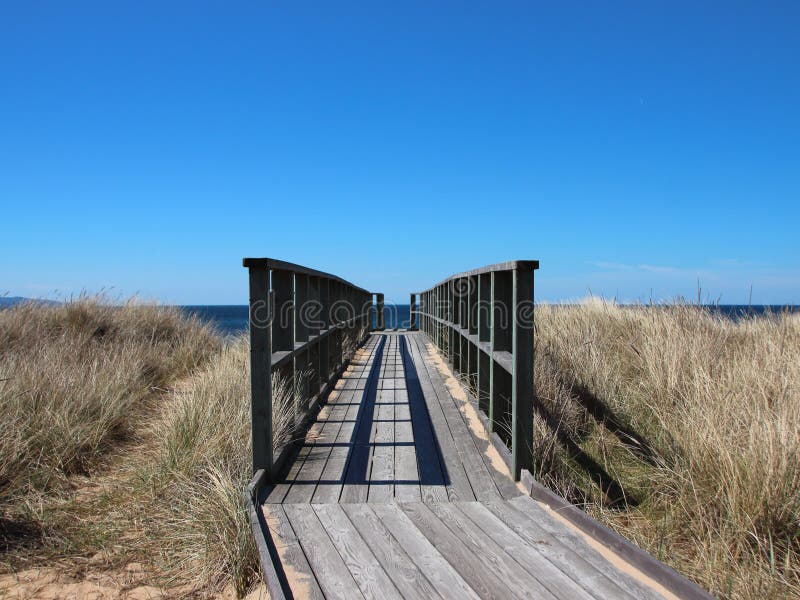 Wooden Path To the Beach with Sand Dunes Stock Photo - Image of railing ...