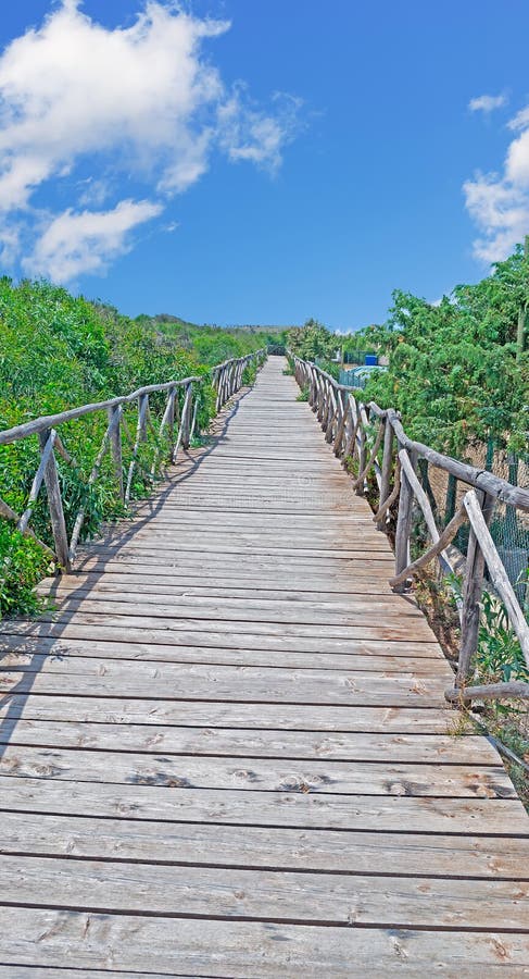 Wooden path stock photo. Image of hand, clouds, coast - 37438812