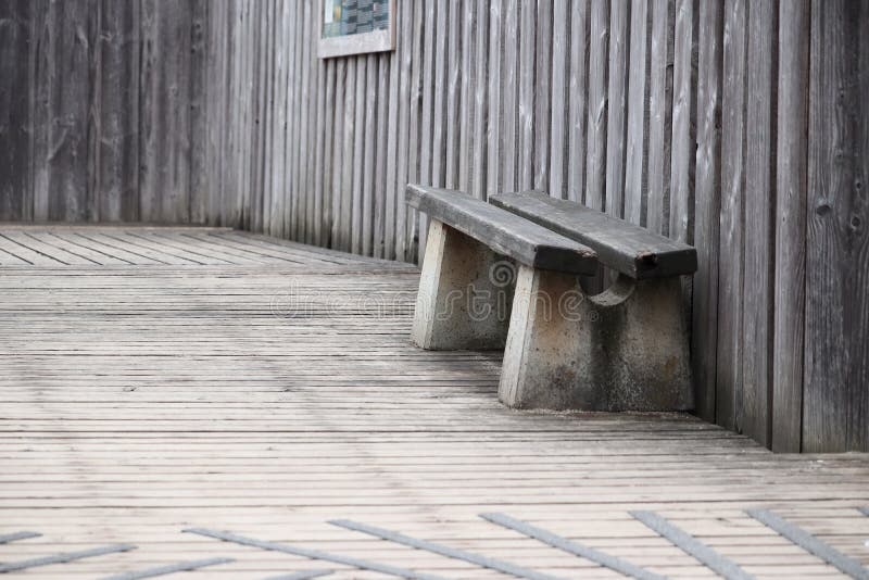 Wooden Pathway with a Bench Near the Wooden Wall Stock Photo - Image of ...