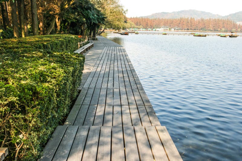 Wooden pathway by the lake stock image. Image of lake - 52724795