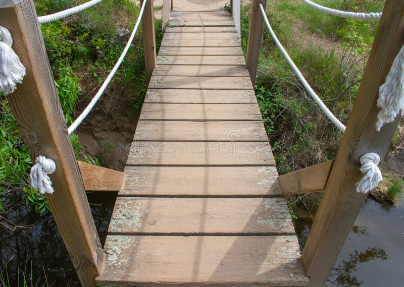 Wooden Pedestrian Bridge and Rope Handrails Stock Photo - Image of ...